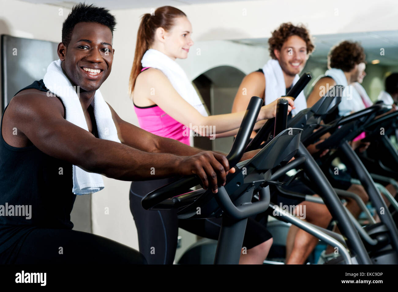 Gym trainer exercising along with his trainees Stock Photo - Alamy