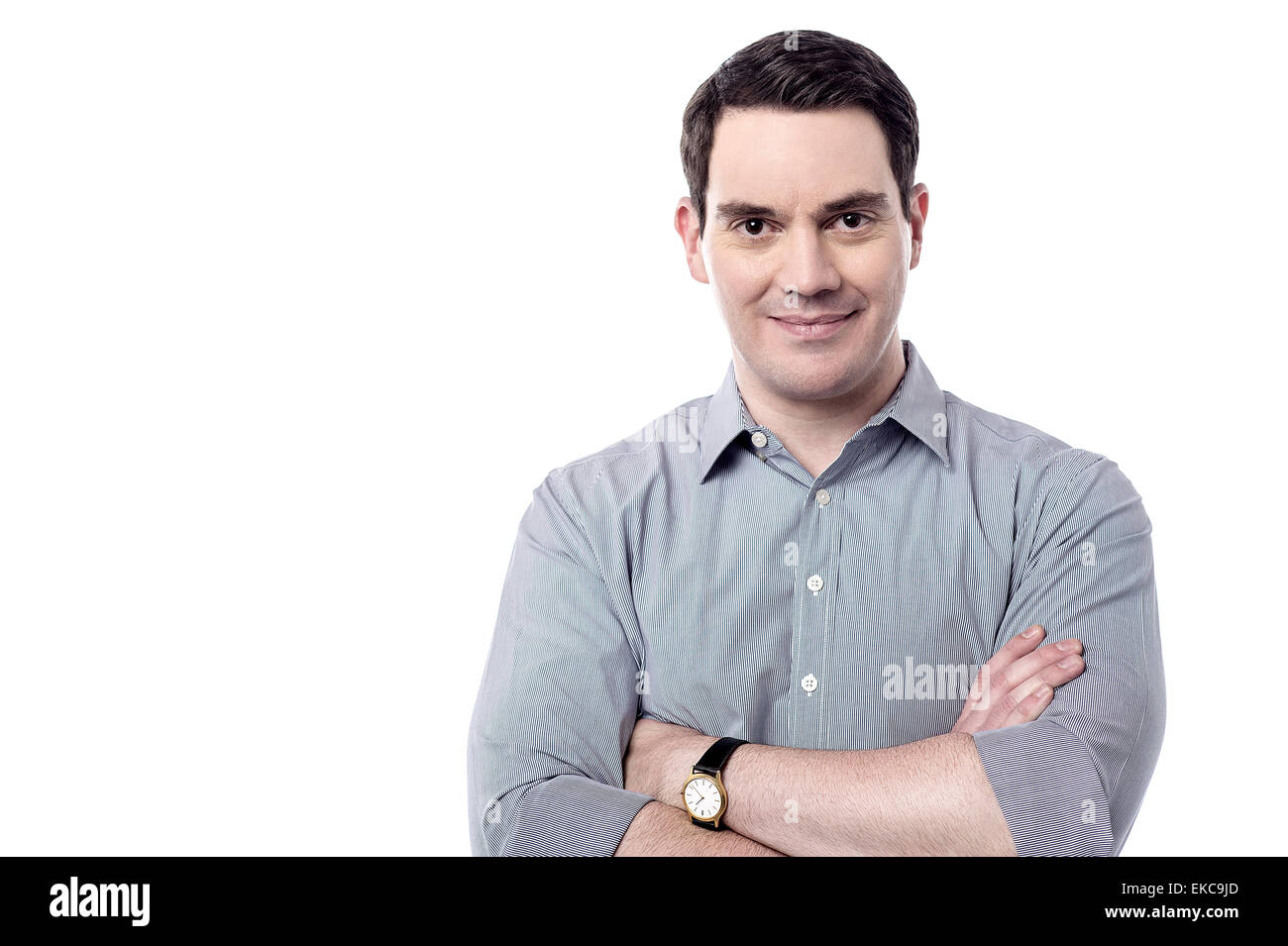 Confident male with arms crossed Stock Photo - Alamy