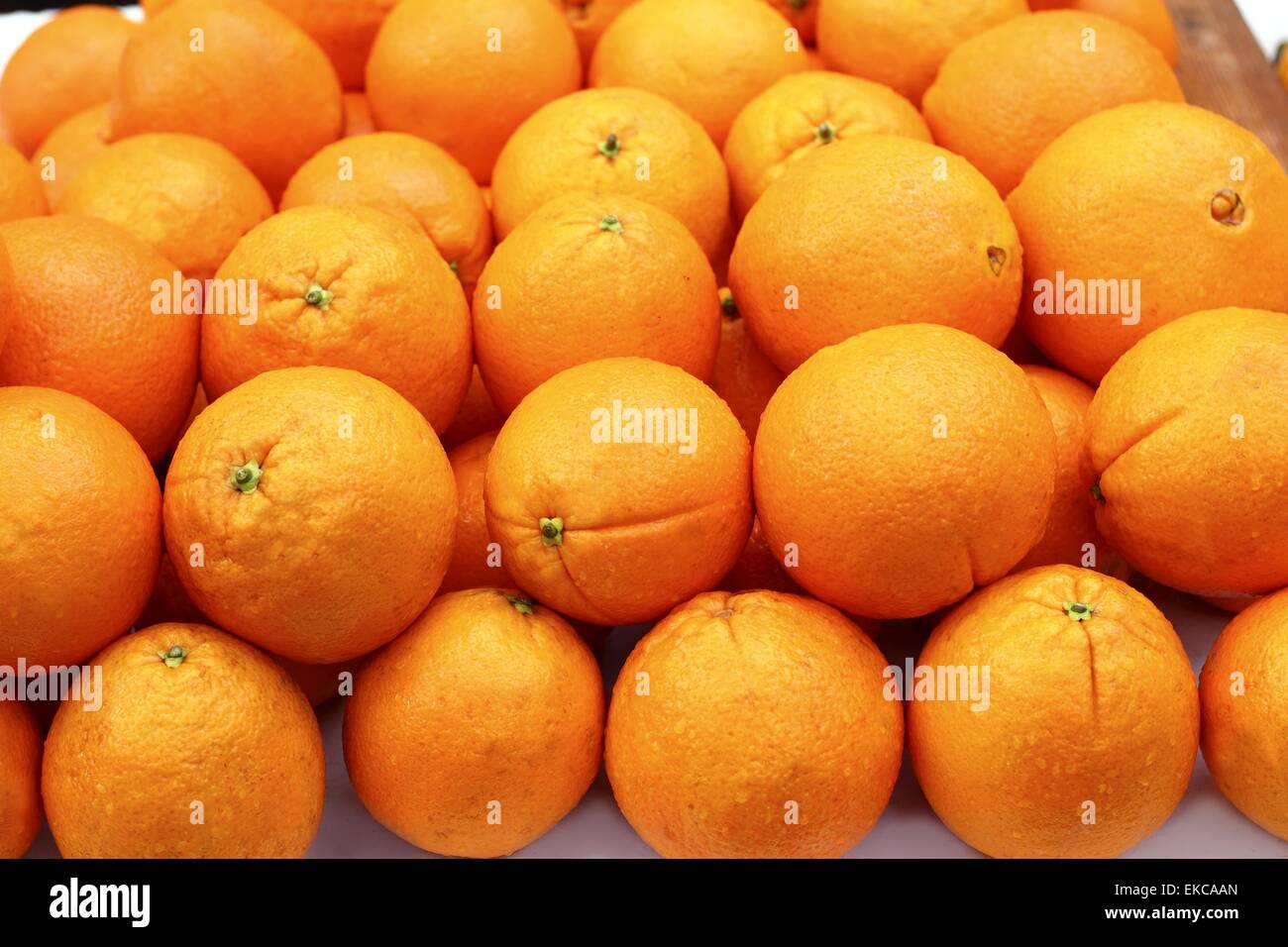 stacked orange fruits rows arranged in market Stock Photo - Alamy