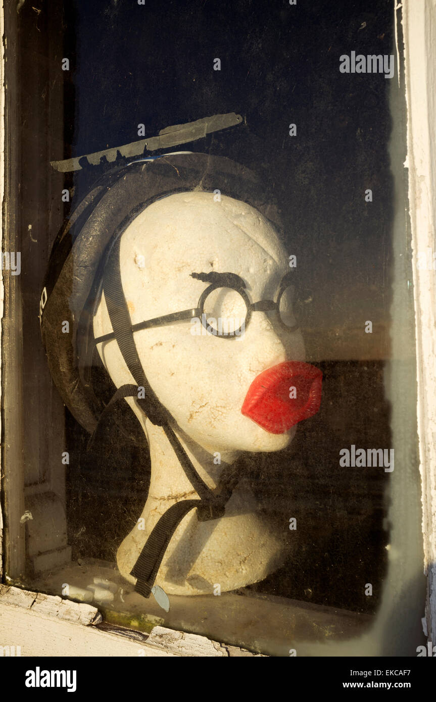 Polystyrene head in the window of a shed Stock Photo - Alamy