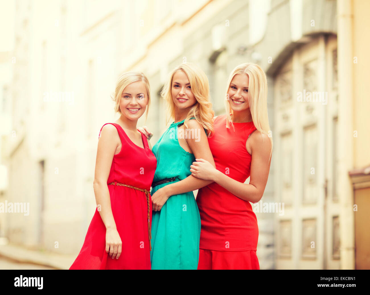 three beautiful women in the city Stock Photo - Alamy