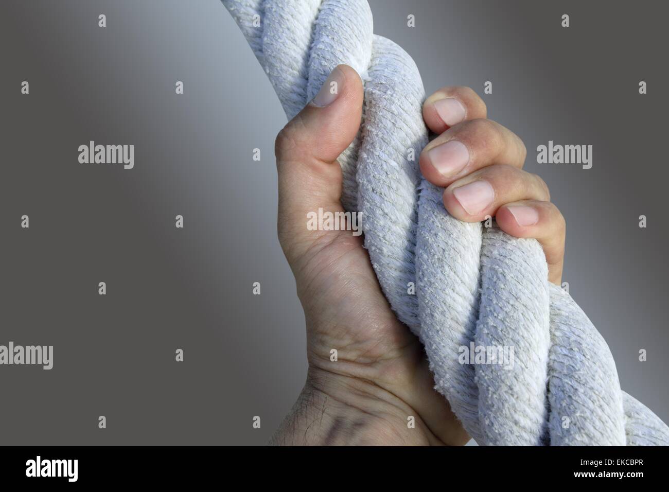 man hand grab grip strong big aged rope Stock Photo - Alamy