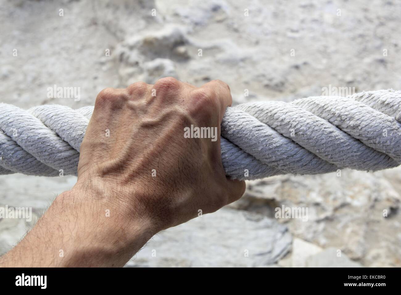 man hand grab grip strong big aged rope Stock Photo - Alamy