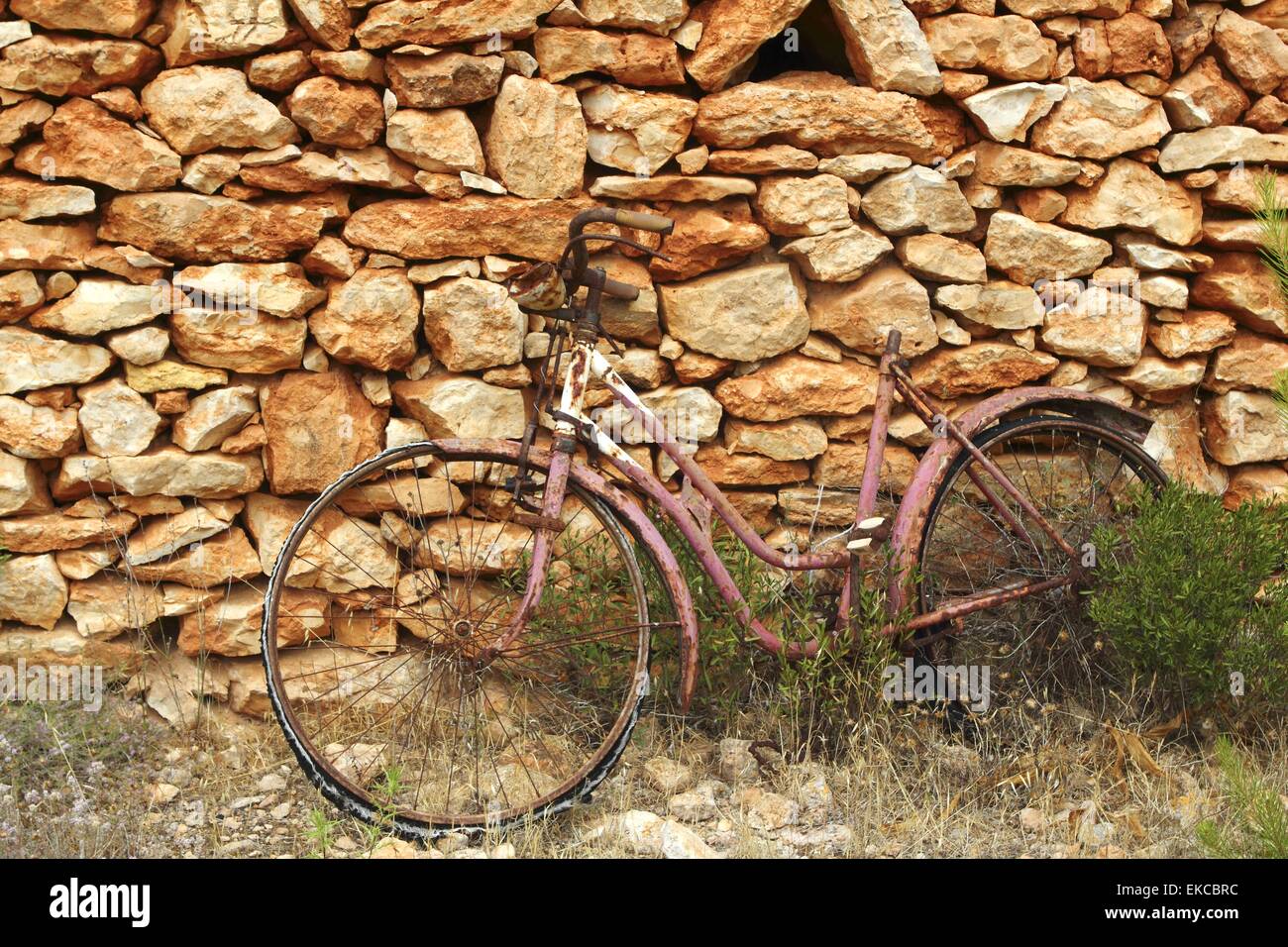 aged weathered bicycle vintage stone wall Stock Photo - Alamy