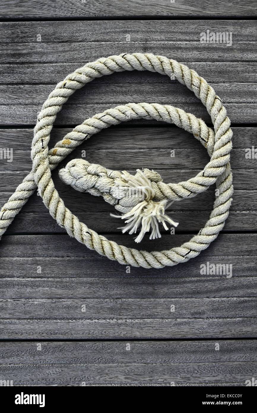 marine rope over gray aged teak wood Stock Photo - Alamy
