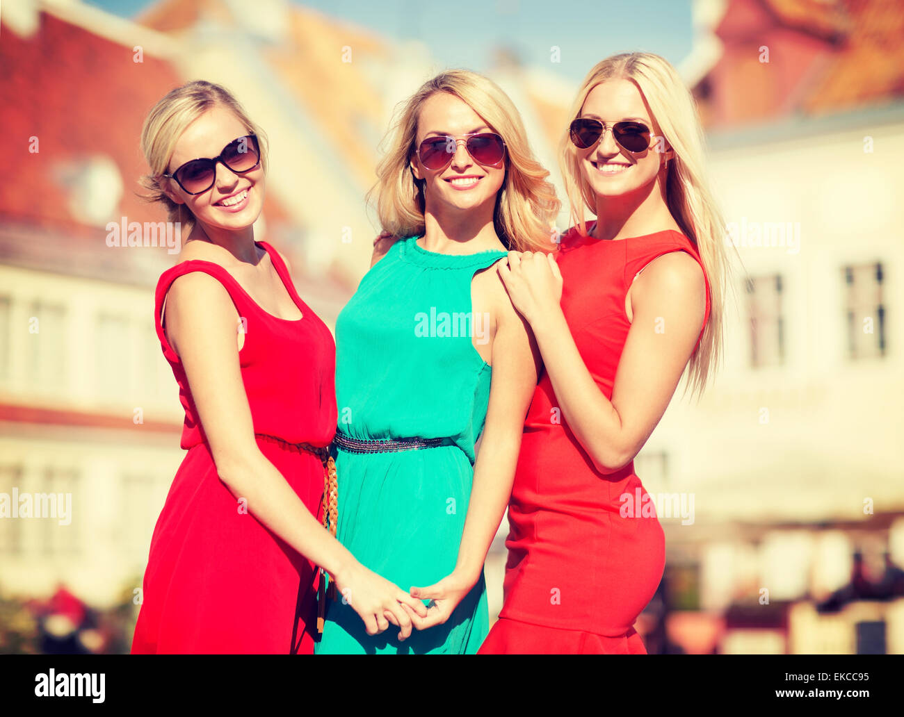 three beautiful women in the city Stock Photo - Alamy