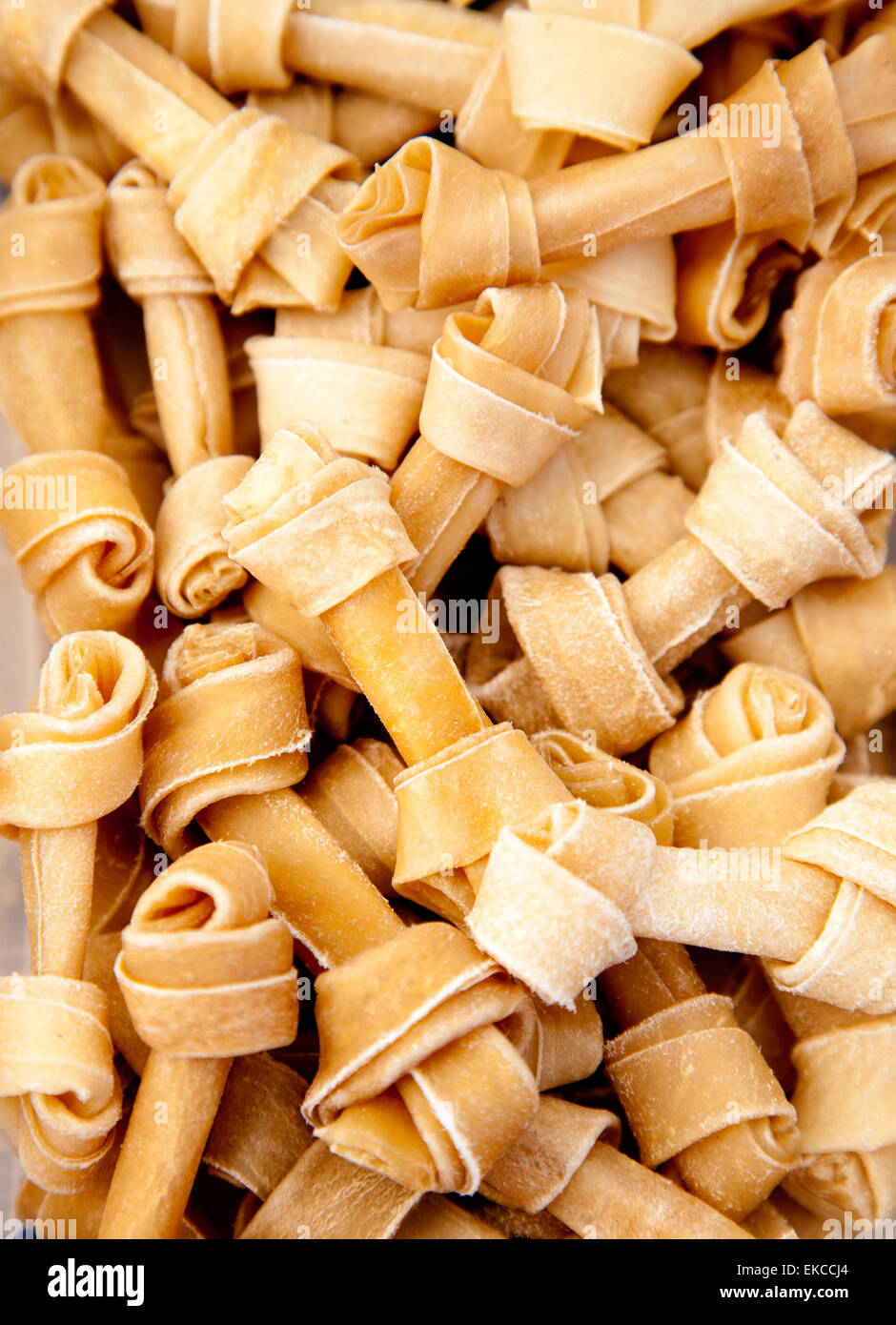 artificial dog bones with two knots Stock Photo - Alamy