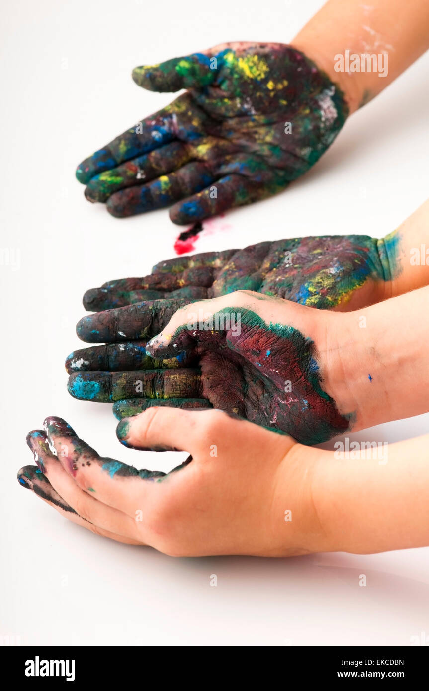 Kids hands covered with paint Stock Photo - Alamy