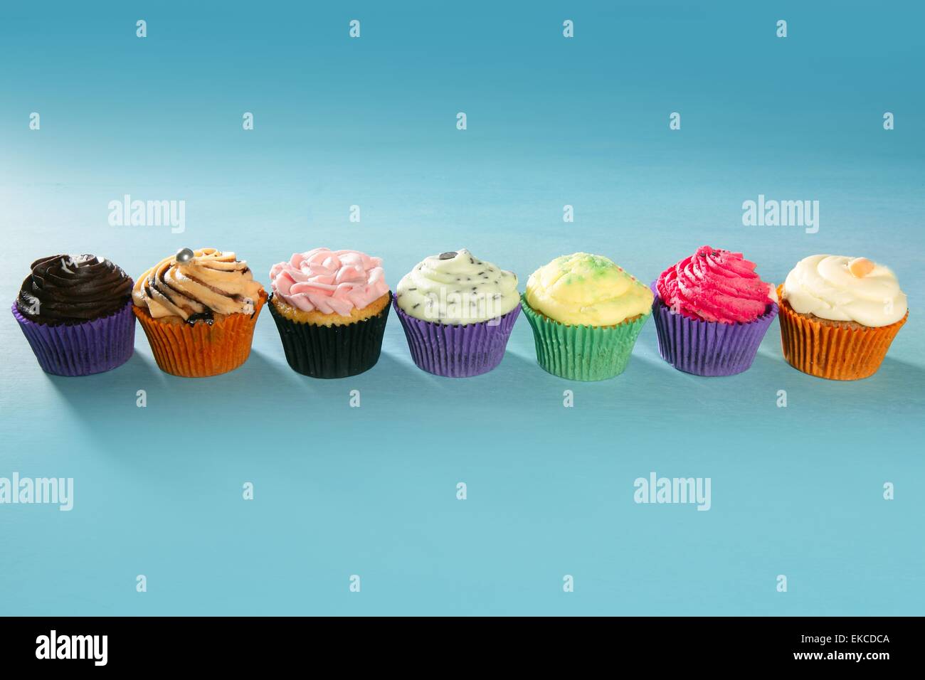 Cupcakes colorful cream muffin arrangement Stock Photo - Alamy