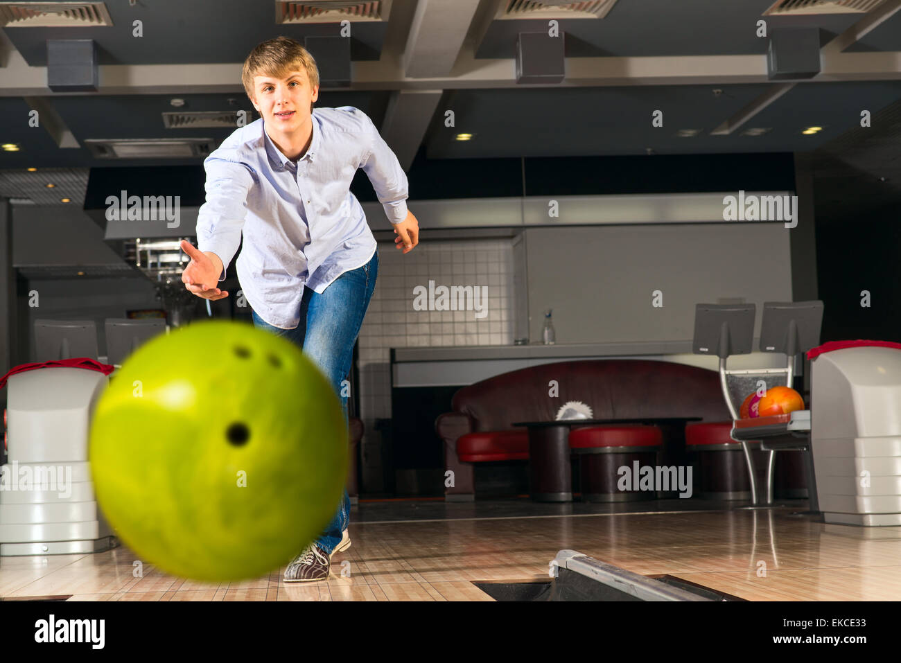young man playing bowling Stock Photo - Alamy