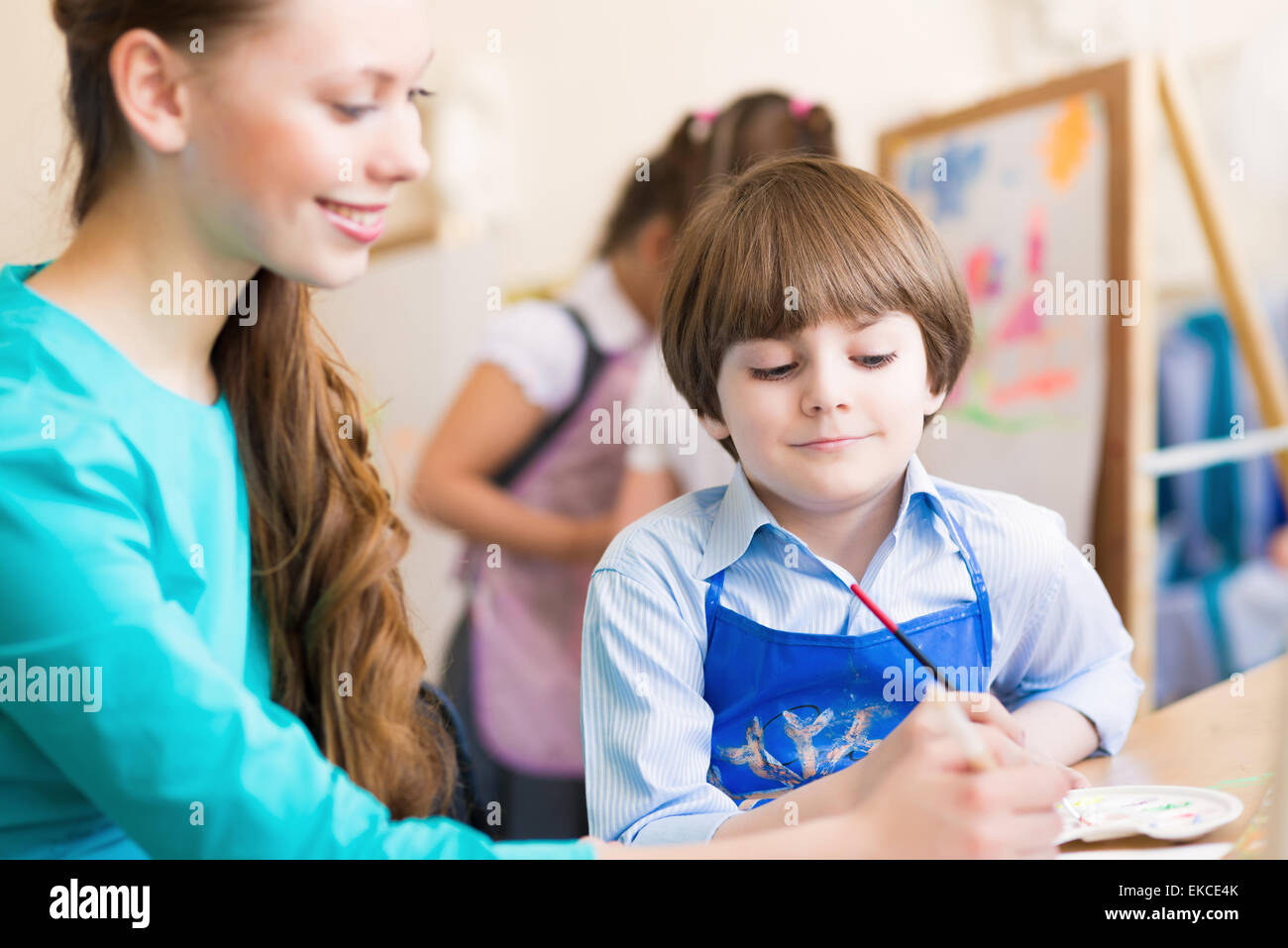 teacher and student in the classroom Stock Photo - Alamy