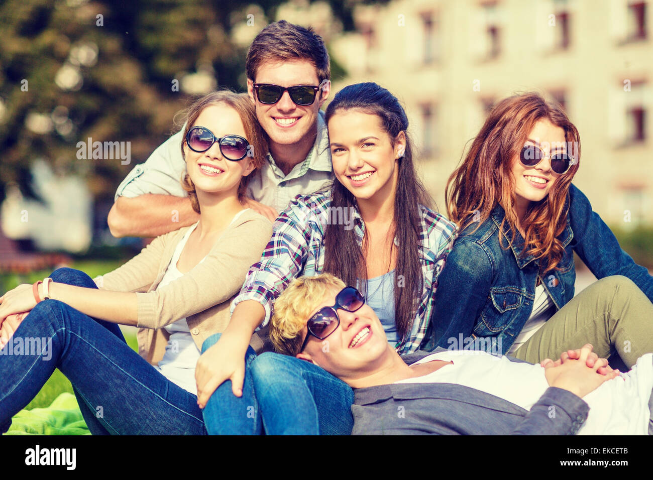 group of students or teenagers hanging out Stock Photo - Alamy