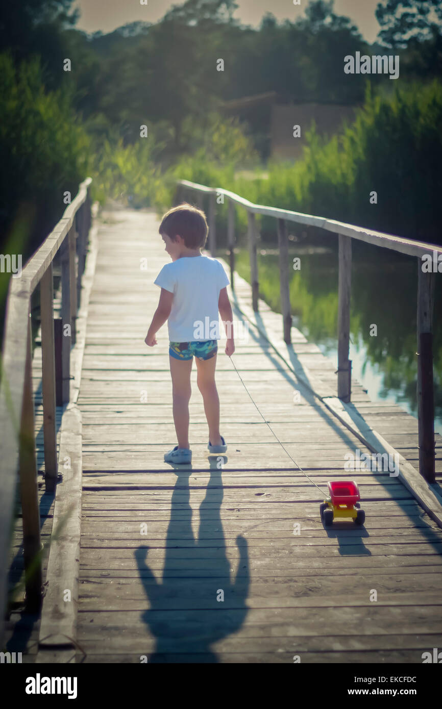Boy pulling toy car hi-res stock photography and images - Alamy