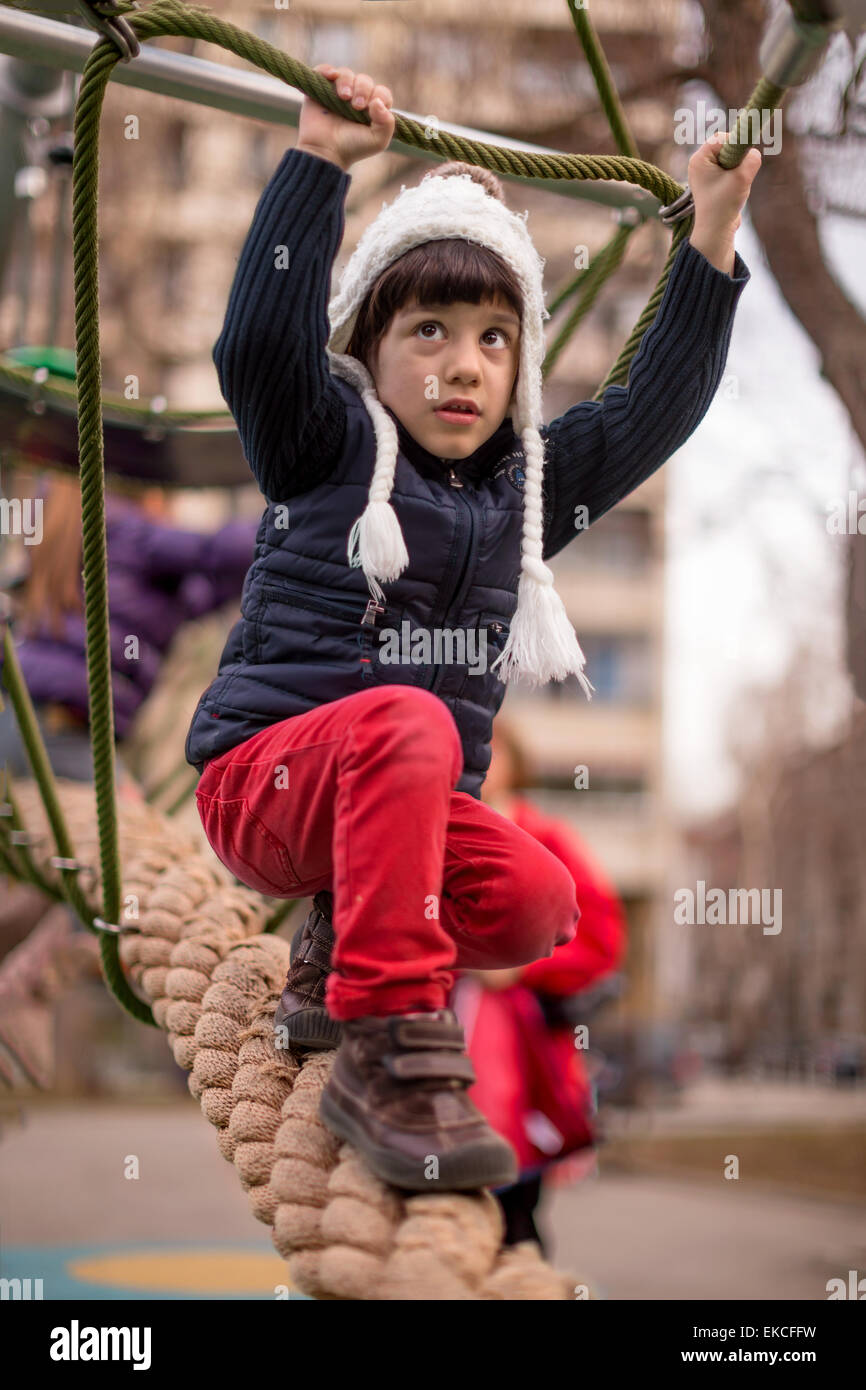 Boy playing in a playground Stock Photo - Alamy