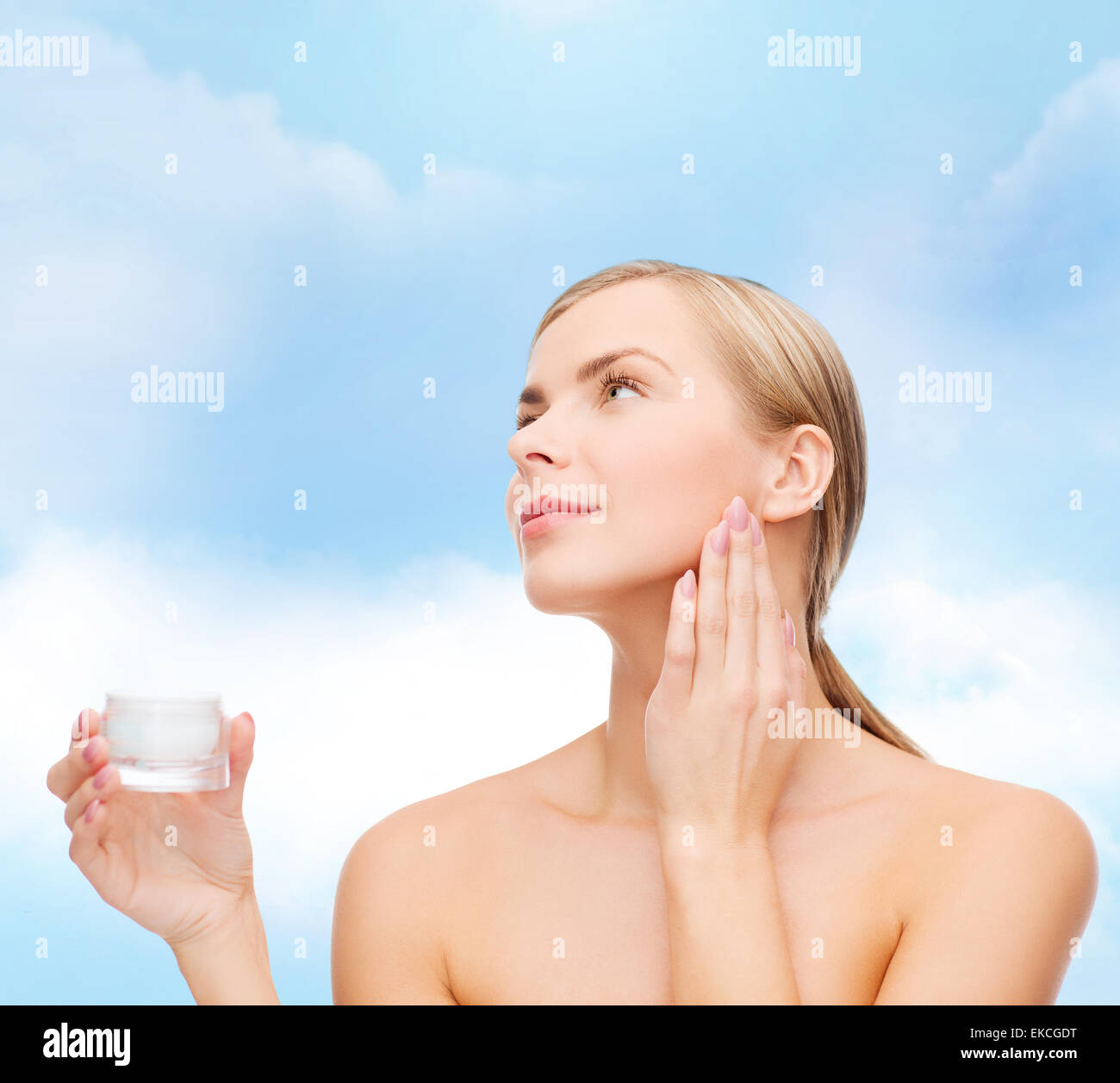 woman applying cream on her skin Stock Photo - Alamy