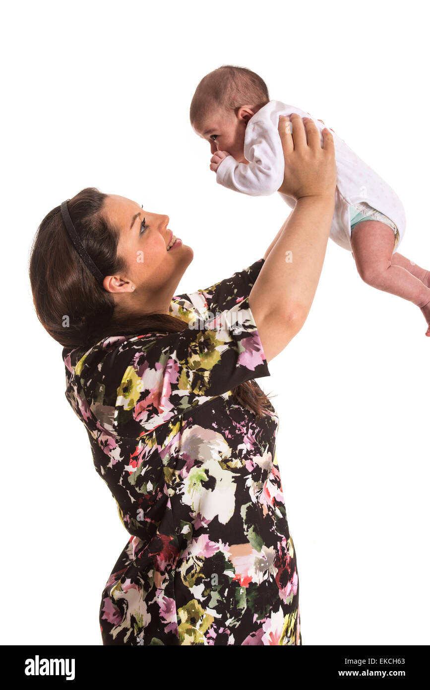 Mother raise up her baby girl two months age isolated on white ...
