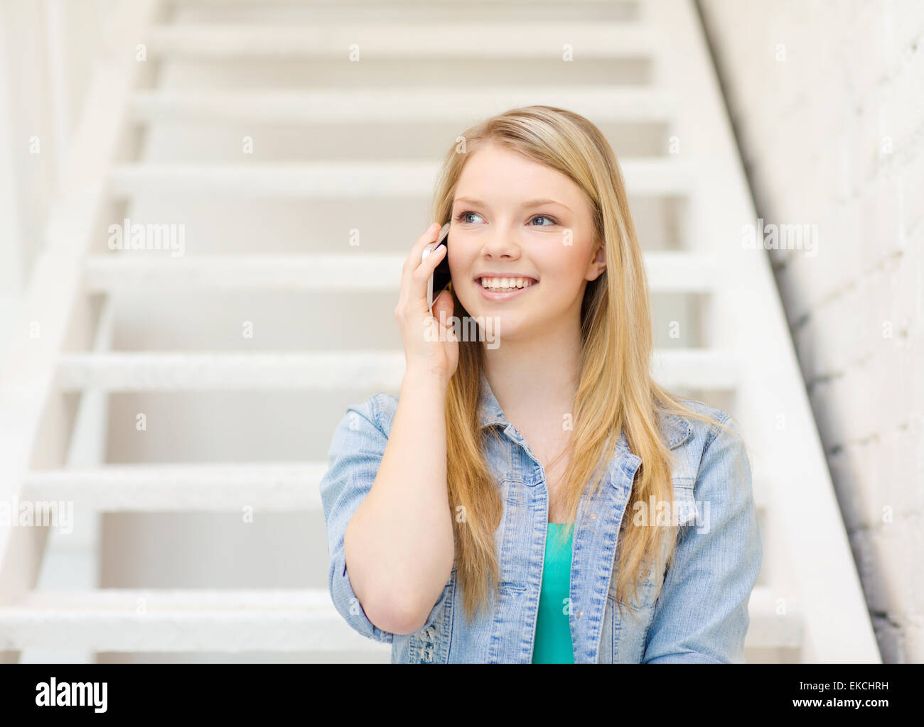 smiling female student with smartphone Stock Photo - Alamy