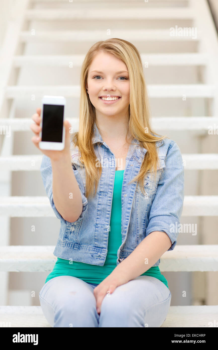 smiling student with smartphone blank screen Stock Photo - Alamy