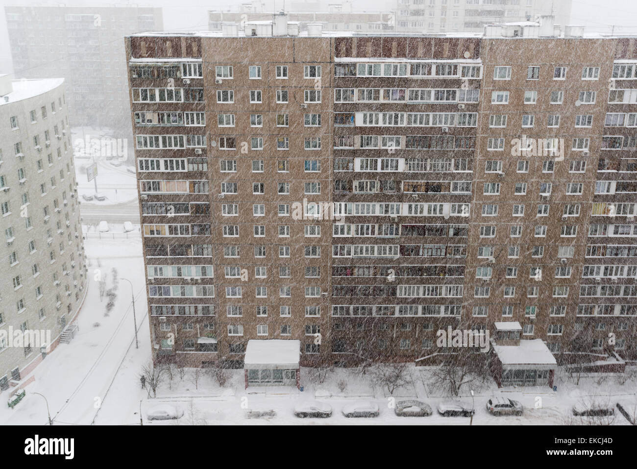Snowfall on a residential building facade background. Winter mood Stock ...