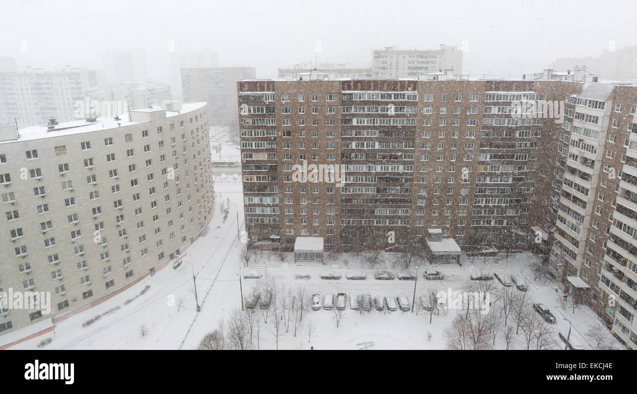 Snowfall on a residential building facade background. Winter mood Stock ...