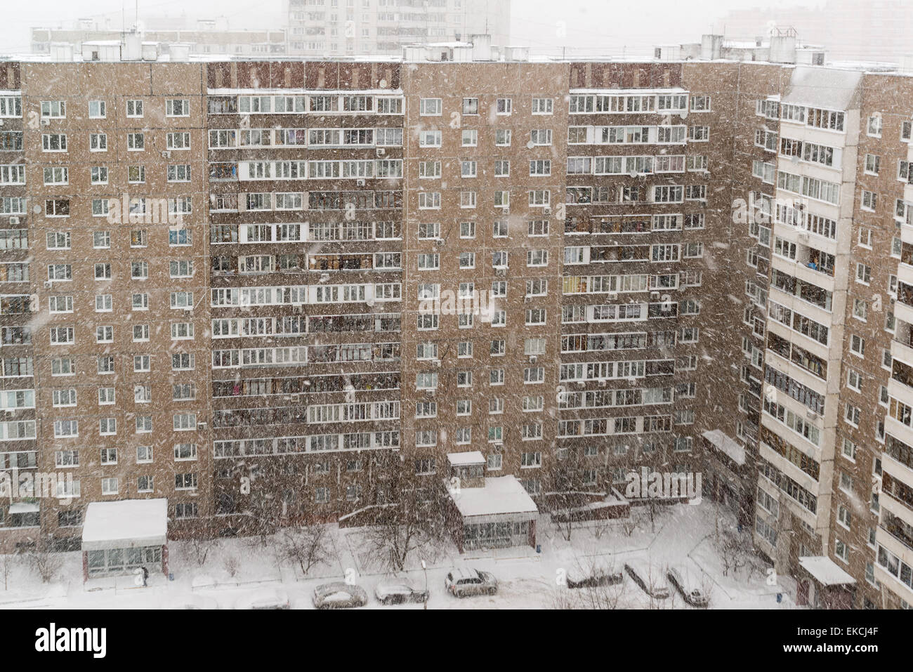 Snowfall on a residential building facade background. Winter mood Stock ...