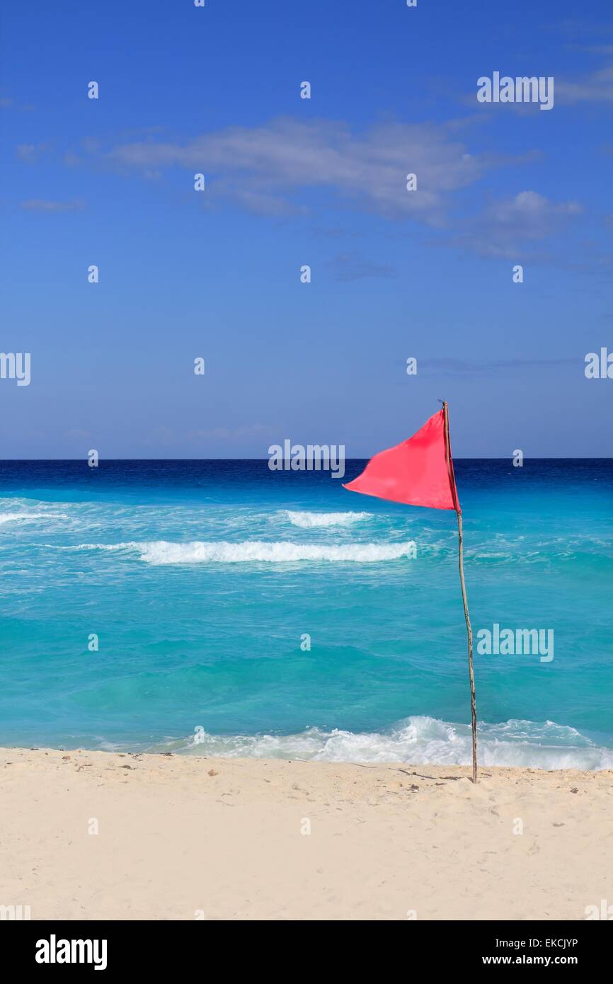dangerous red flag in beach rough sea signal Stock Photo - Alamy