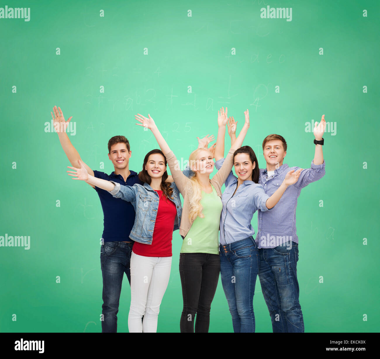 group of smiling students waving hands Stock Photo - Alamy
