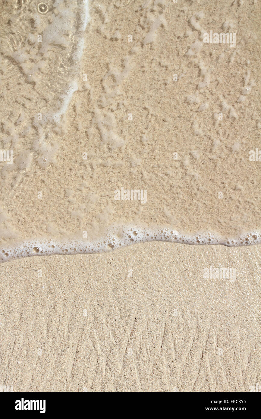 Caribbean clear beach sand texture shore wave Stock Photo - Alamy