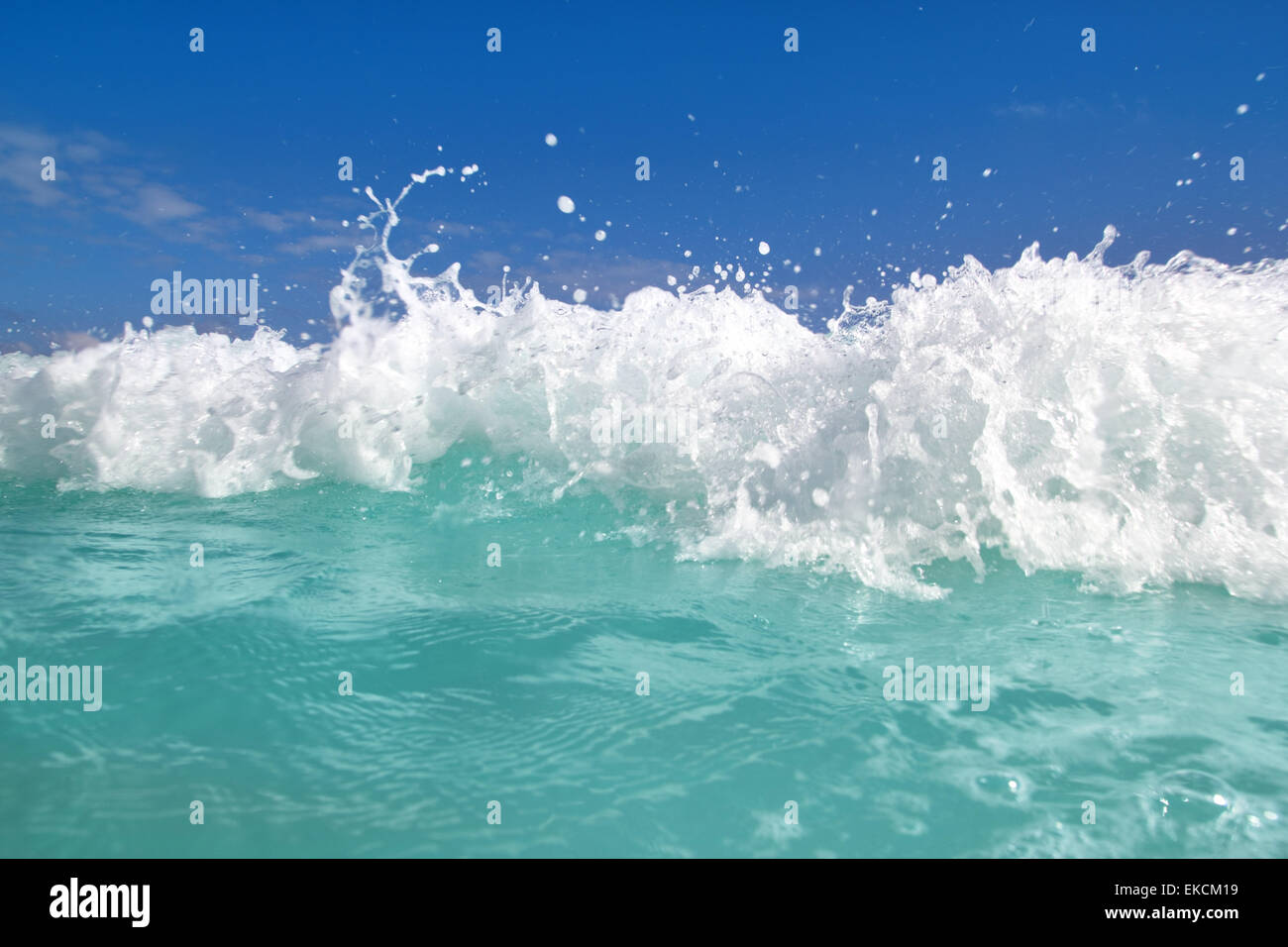 blue turquoise wave caribbean sea water foam Stock Photo - Alamy