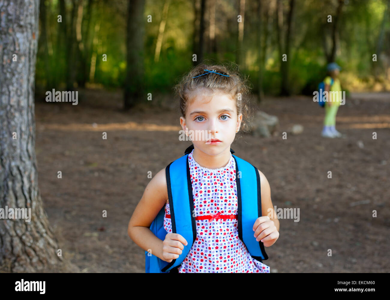 Children girl hiking with backpack in forest Stock Photo - Alamy
