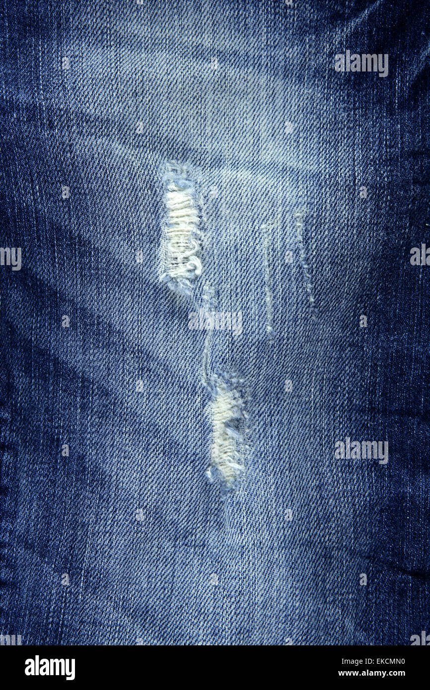 denim fashion blue jeans broken fabric texture Stock Photo - Alamy