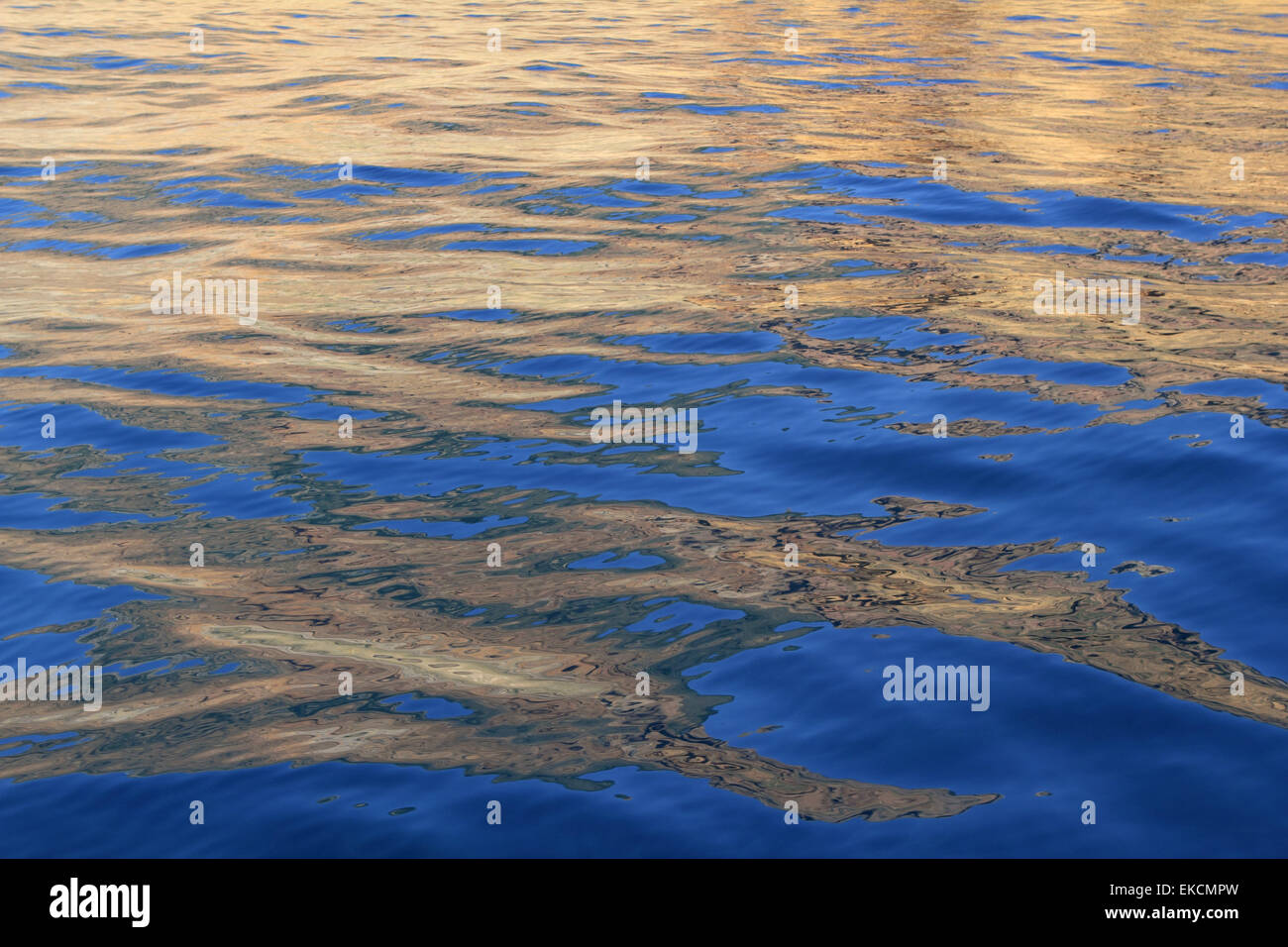 Abstract golden reflection blue water shapes Stock Photo - Alamy
