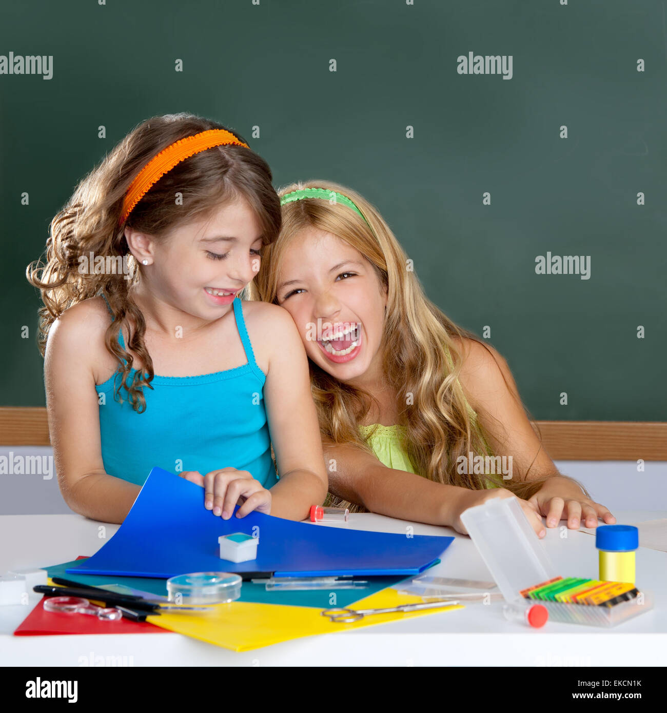 happy laughing kids student girls at school classroom Stock Photo - Alamy