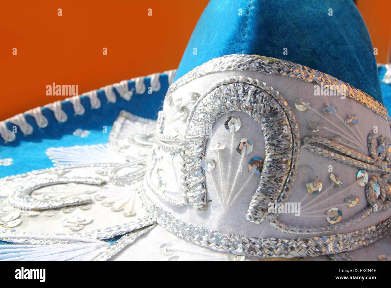 charro mariachi blue mexican hat detail over orange Stock Photo - Alamy