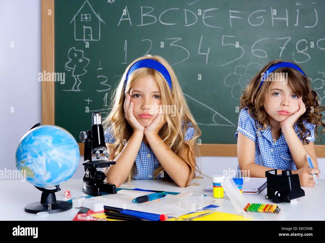Bored student kids at school classroom in desk Stock Photo - Alamy