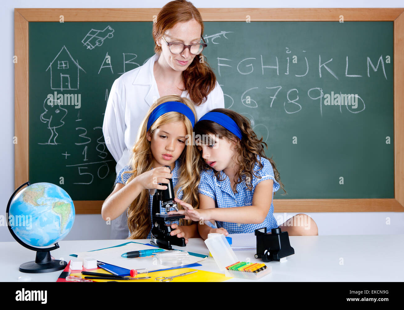 kids students with nerd teacher woman at school Stock Photo - Alamy