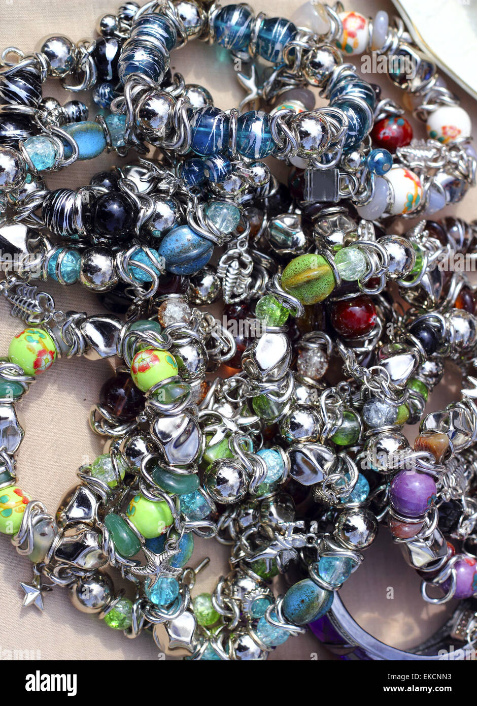 colorful jewelry mess in market background Stock Photo - Alamy