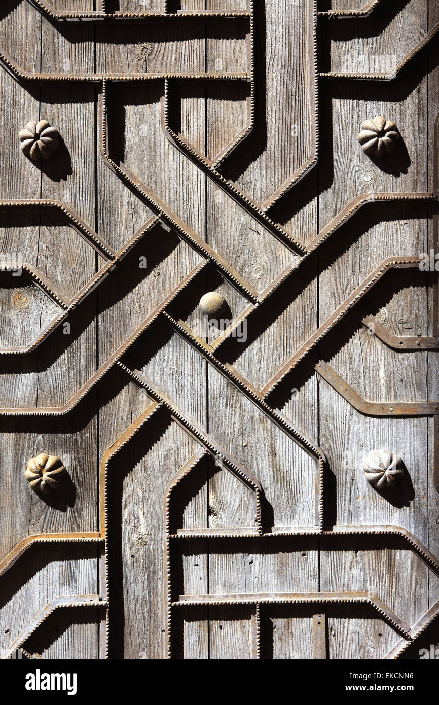 old aged wooden door iron handcraft deco Stock Photo - Alamy