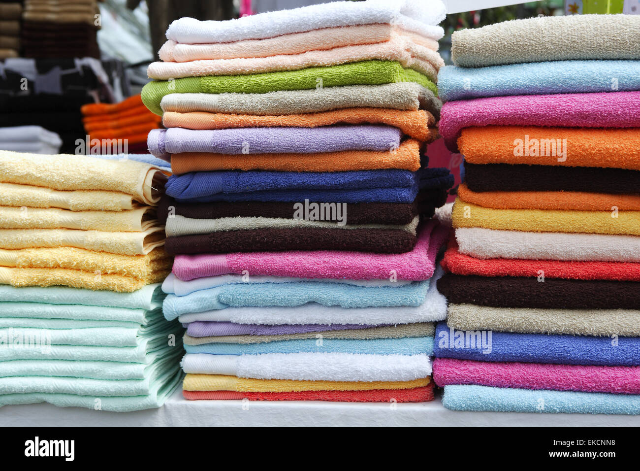 colorful towel stacked rows in market Stock Photo - Alamy