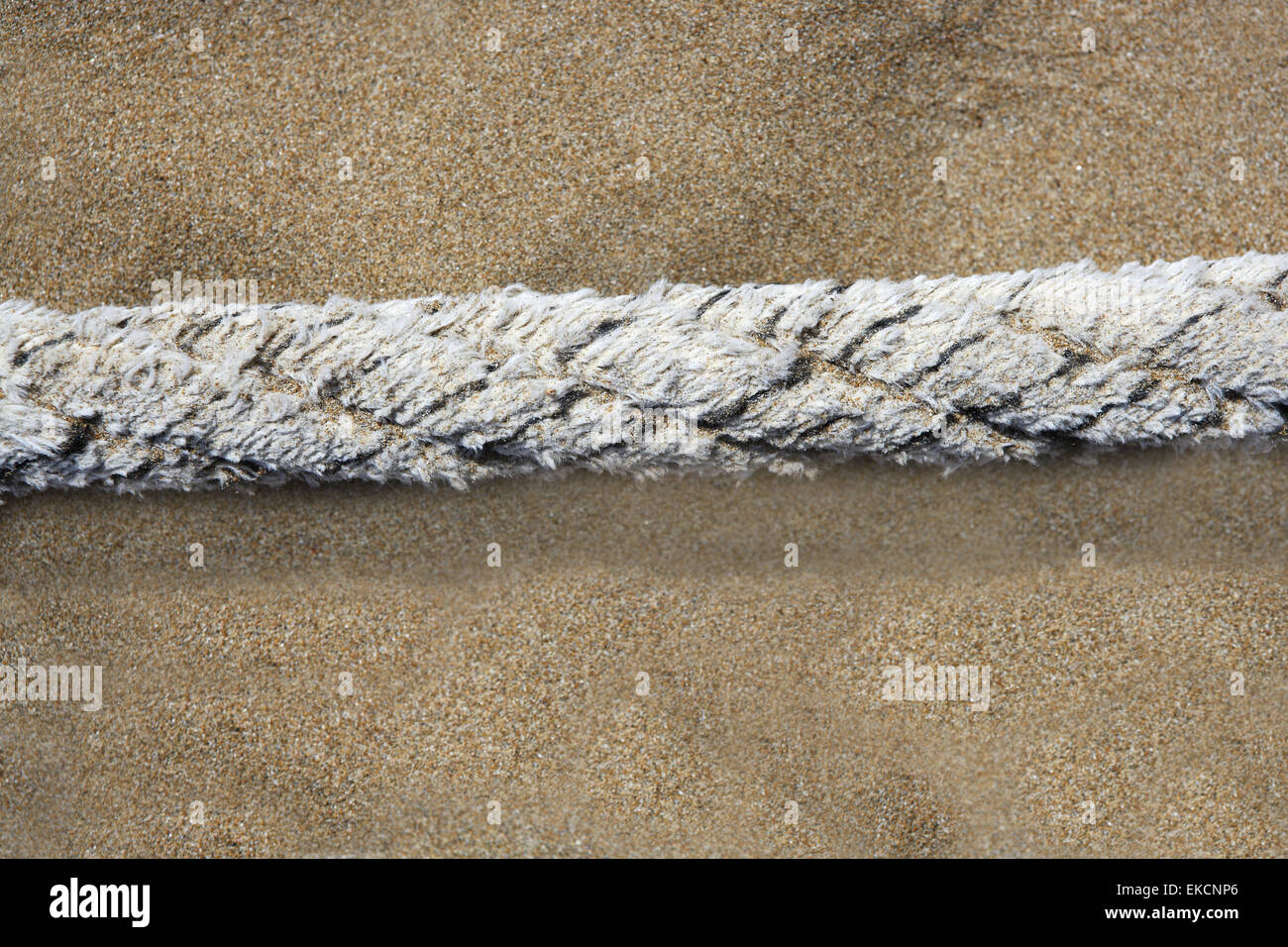 aged marine rope over beach sand background Stock Photo - Alamy
