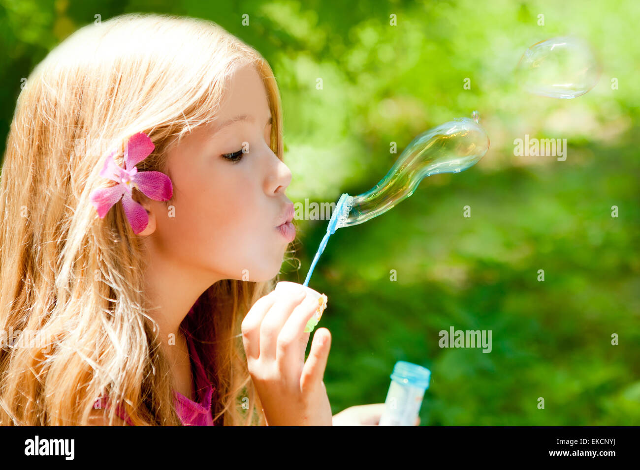 Children blowing soap bubbles in outdoor forest Stock Photo - Alamy
