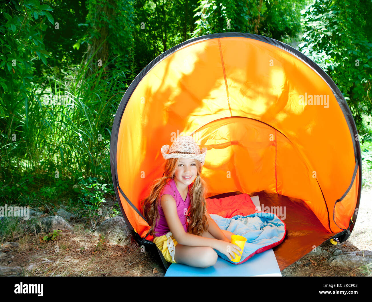 Camping children girl with hat in forest tent outdoor Stock Photo - Alamy