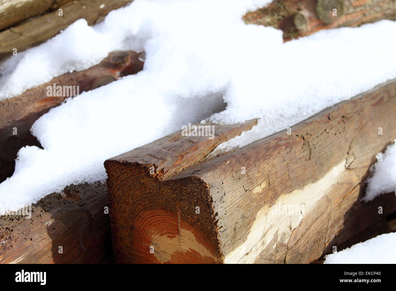 snow on wood beams in winter time Stock Photo - Alamy