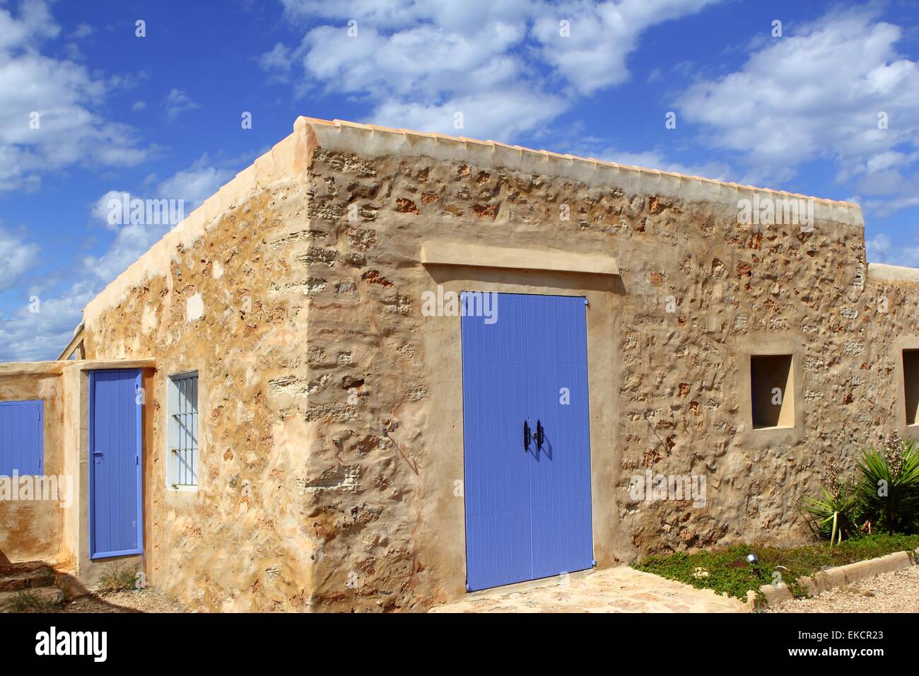 stone house masonry blue sky door windows Stock Photo - Alamy