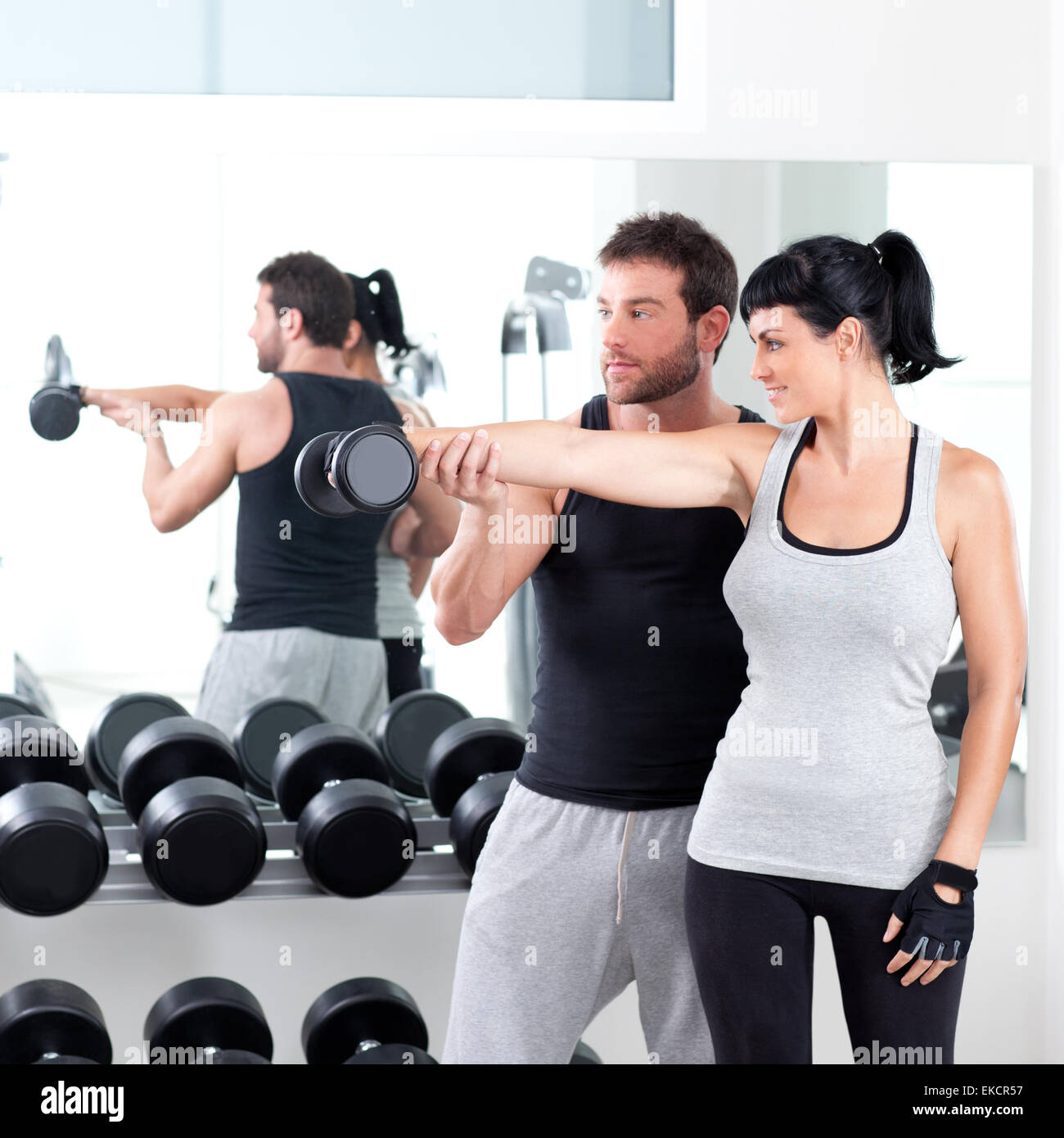 gym woman personal trainer with weight training Stock Photo - Alamy