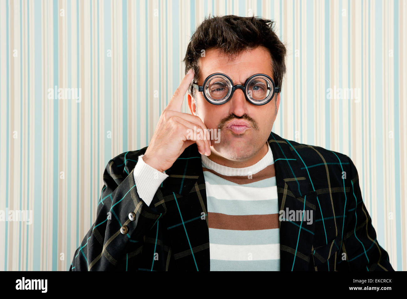 crazy nerd man myopic thinking funny gesture Stock Photo - Alamy