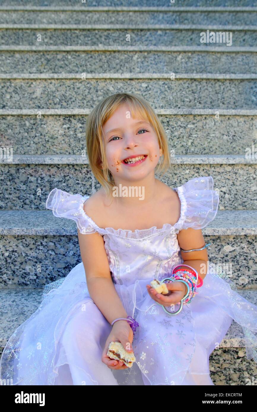 blond children princess girl eating chocolate sandwich Stock Photo - Alamy