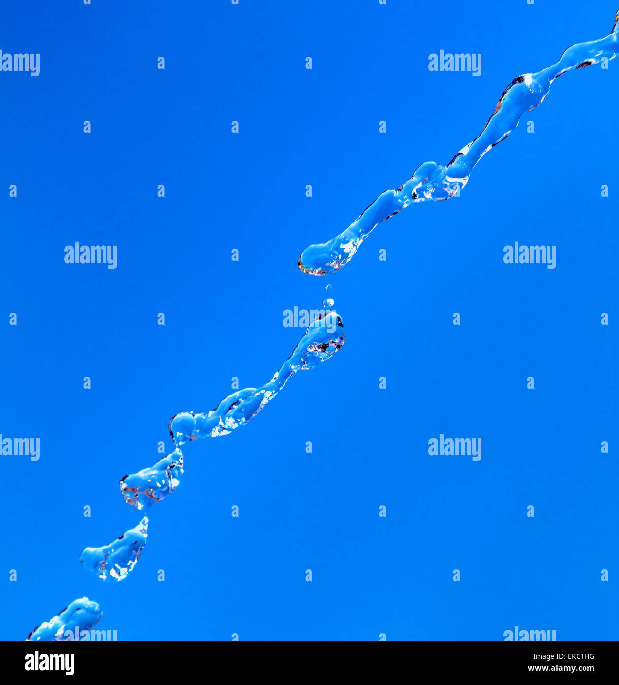 water splash in blue sky background Stock Photo - Alamy