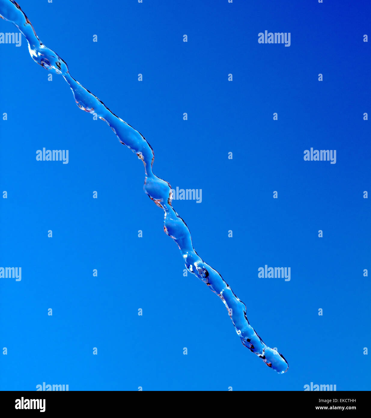 water splash in blue sky background Stock Photo - Alamy