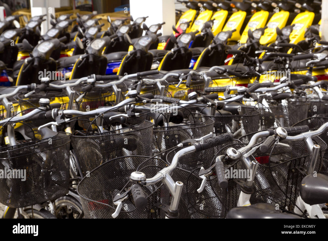 bicycles and scooter bikes rows in a renting shop Stock Photo - Alamy